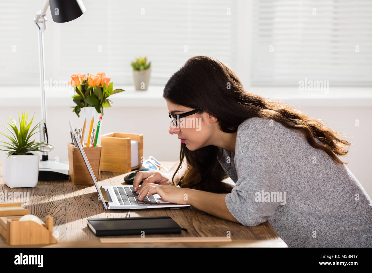 Wrong sitting posture hi-res stock photography and images - Alamy