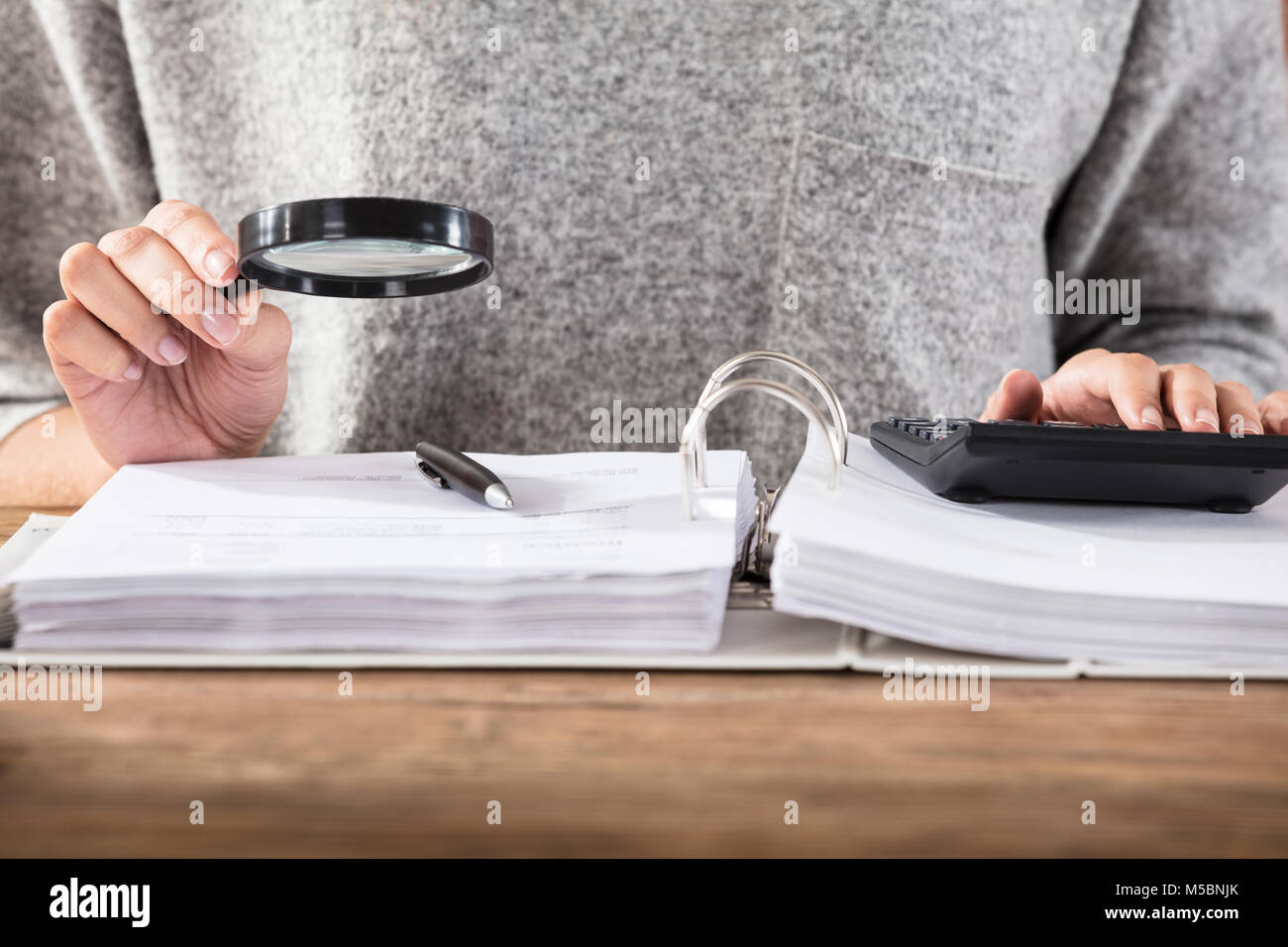Close-up Of A Businesswoman Examining The Documents With Magnifying ...