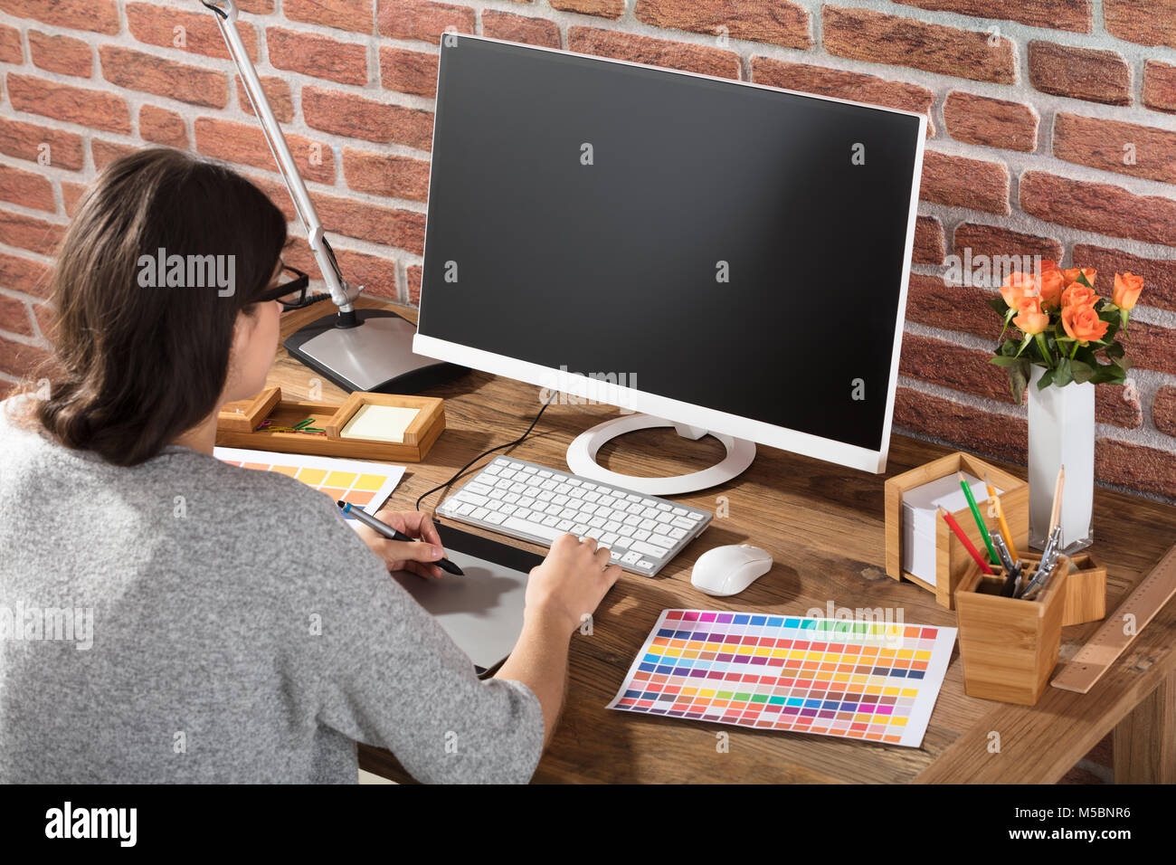 Rear View Of A Woman Using Computer Stock Photo - Alamy