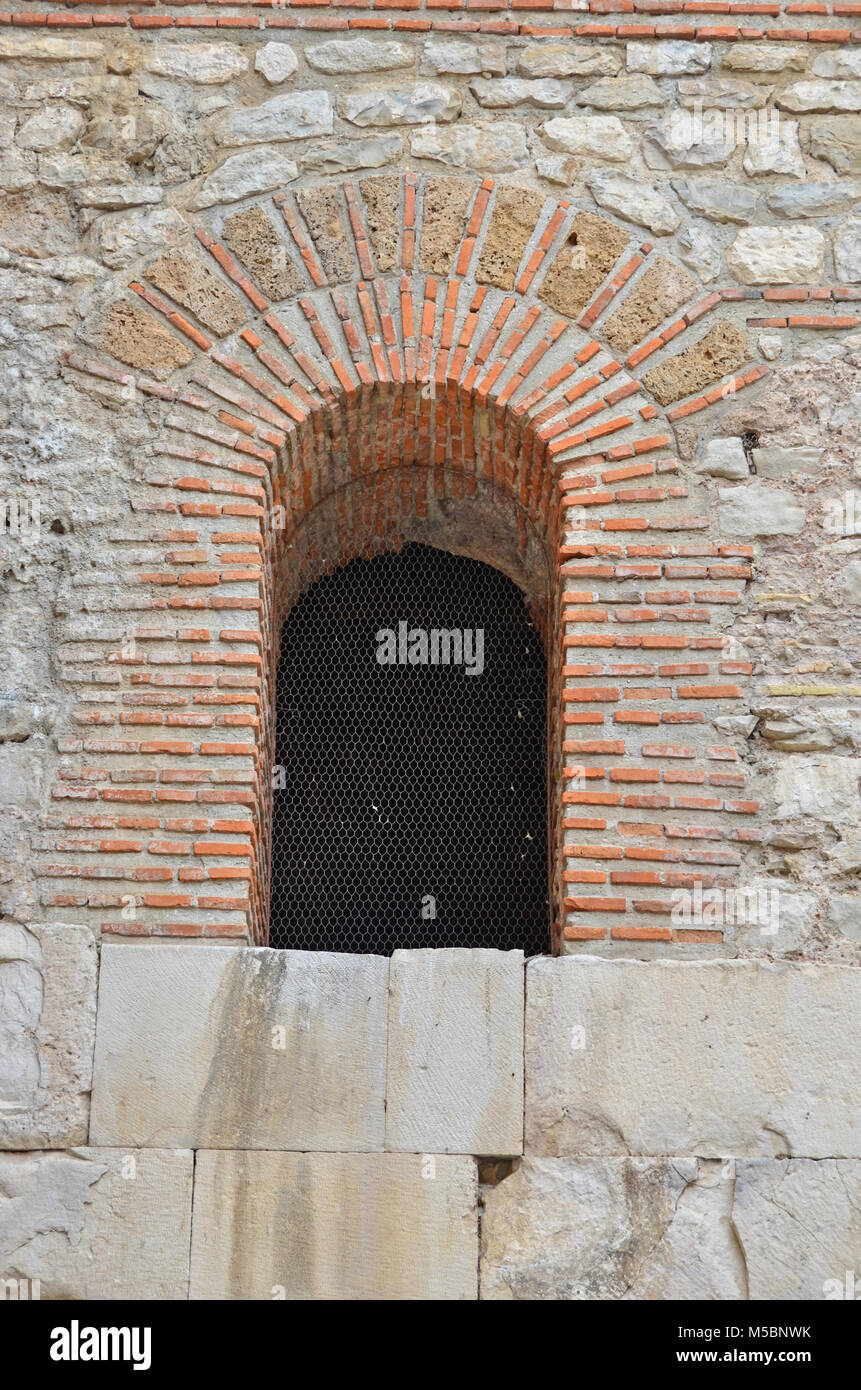Ancient Roman arch constructed from two courses of mixed dressed stone ...
