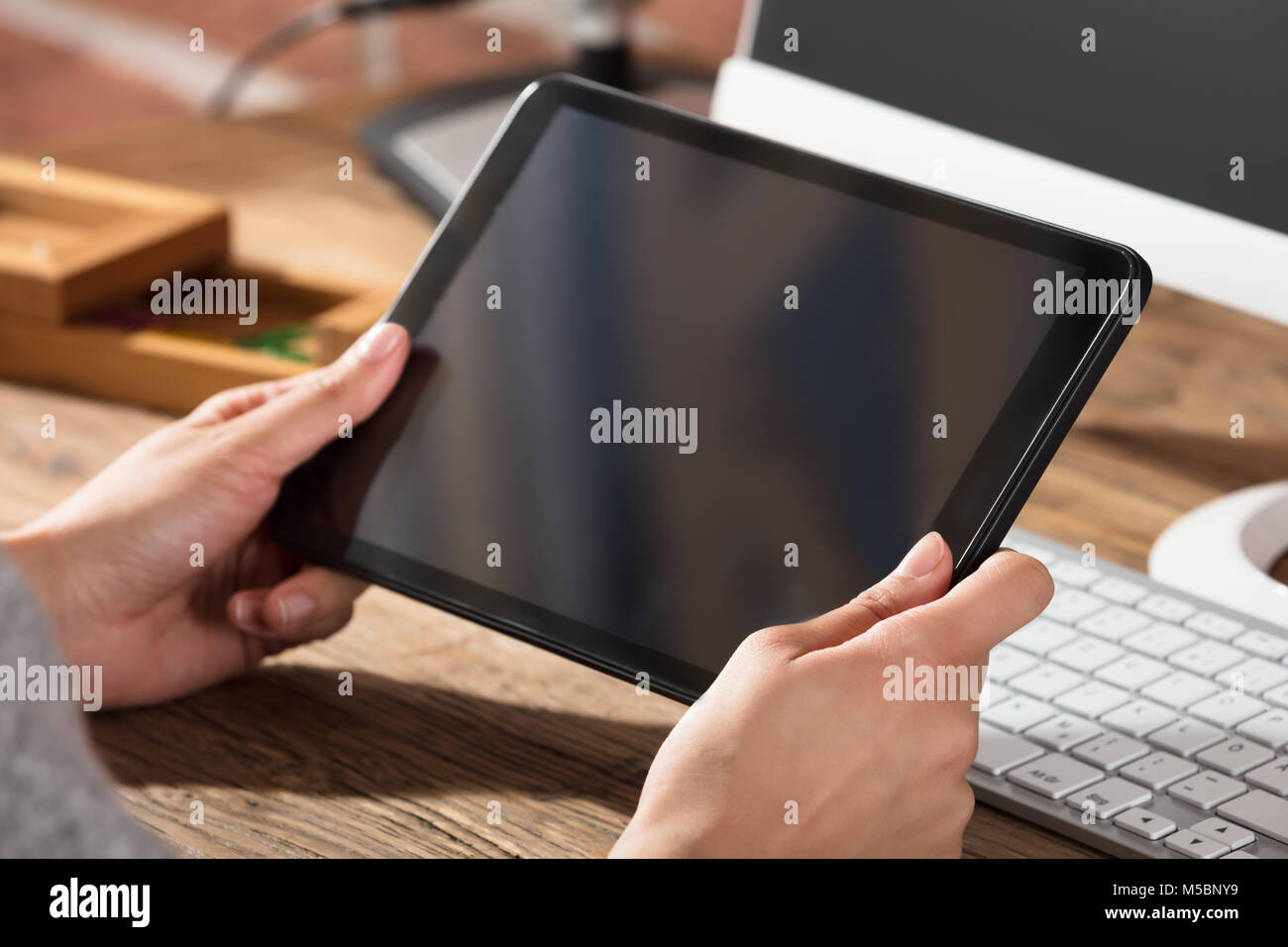 Close-up Of A Woman Looking At Digital Tablet With Blank Screen At ...