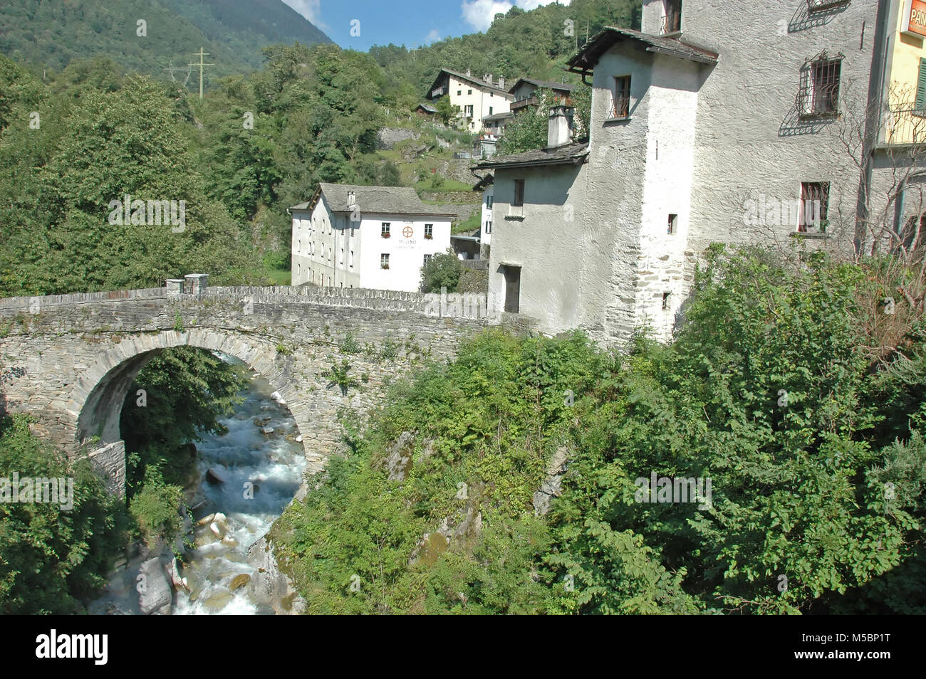 A medieval village built around a roman bridge in the southern swiss ...
