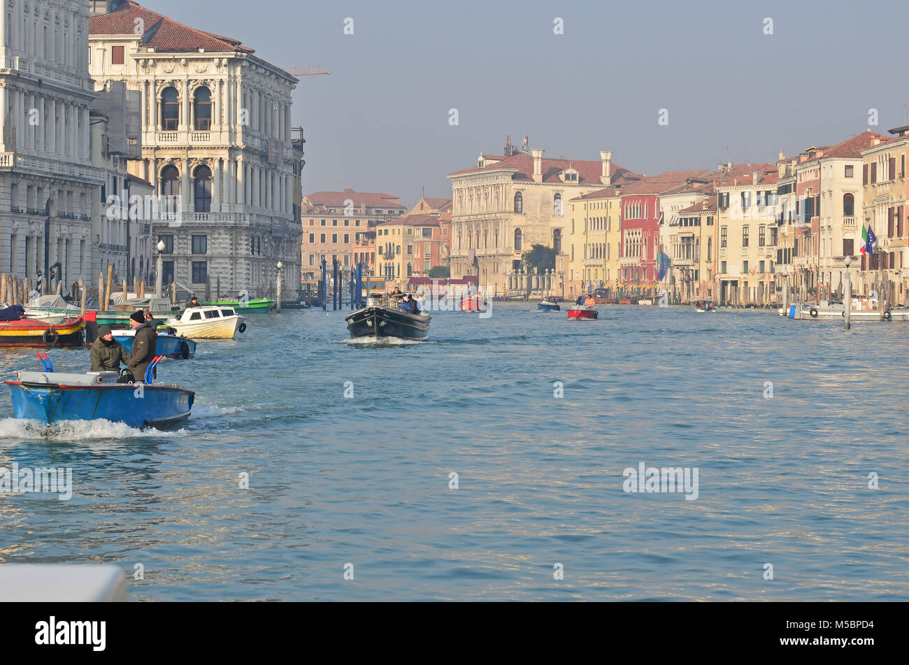 VENICE, ITALY - JANUARY 27: Boats travel up and down the Grand Canal in ...