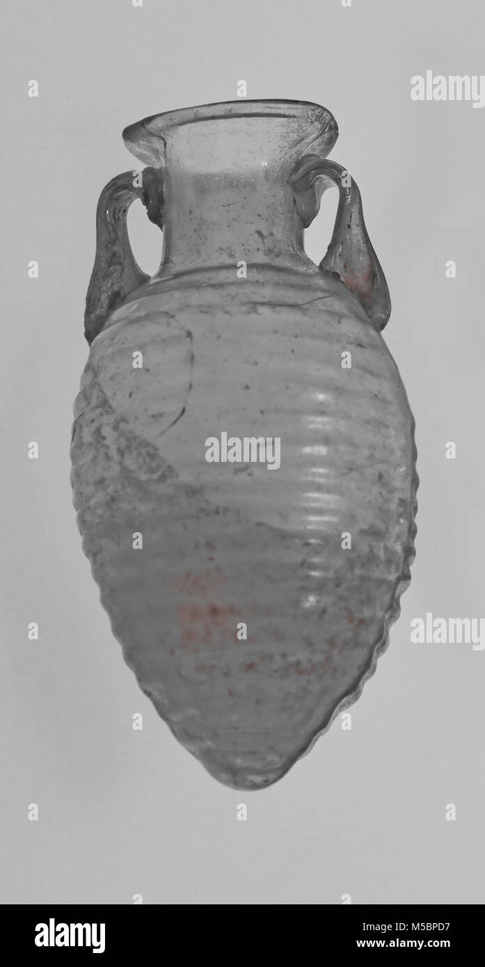 Ancient roman small and clear glass phial with handles and ...