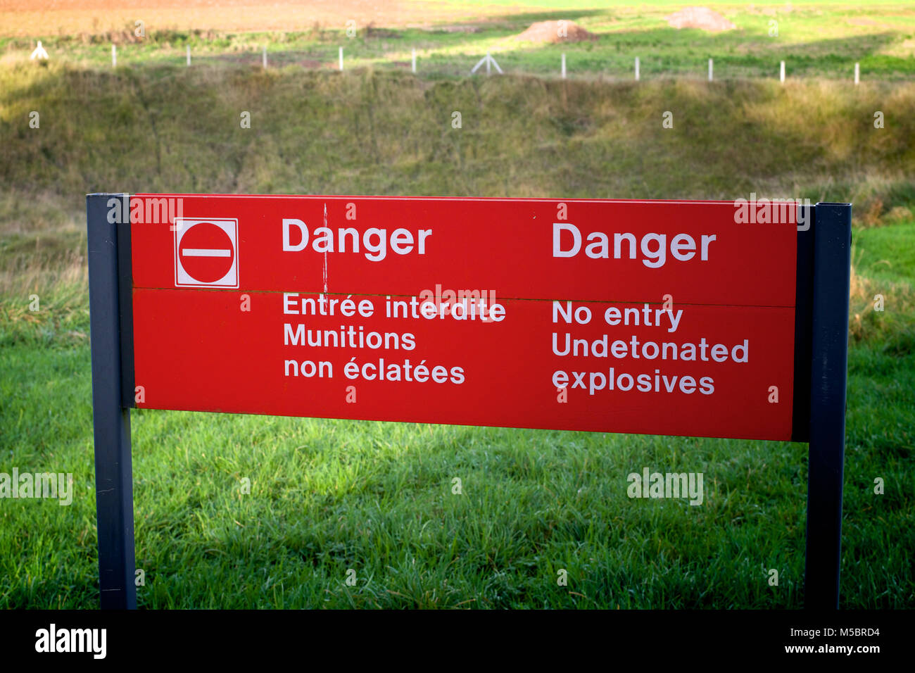 A sign warning of the presence of unexploded shells dating back to WWI ...