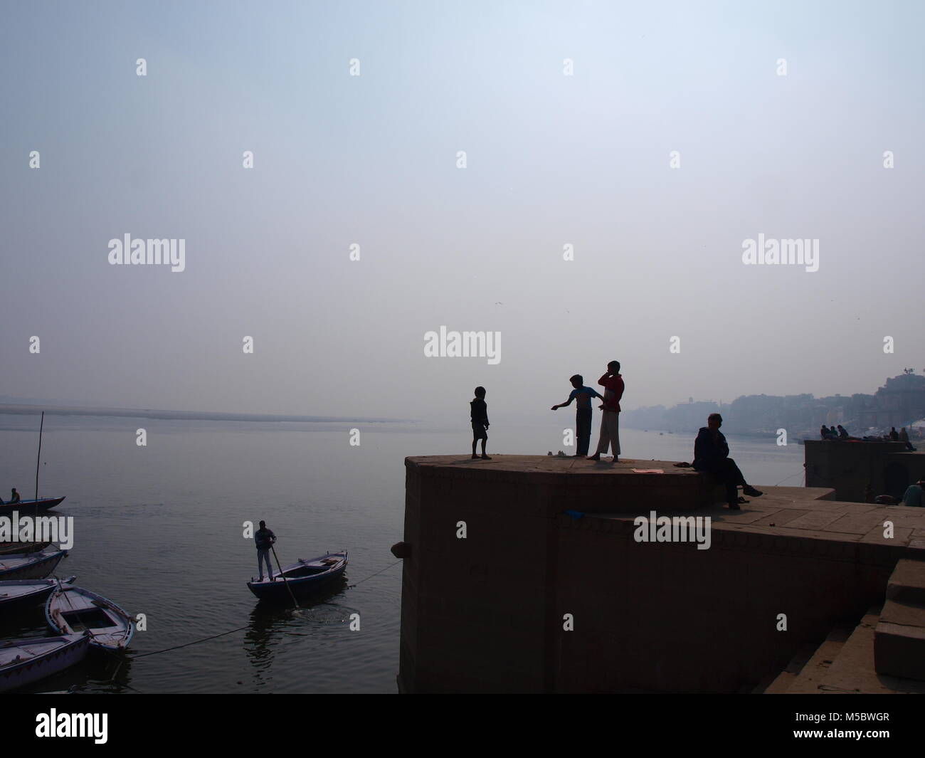 Boys playing by the river Ganges Stock Photo - Alamy