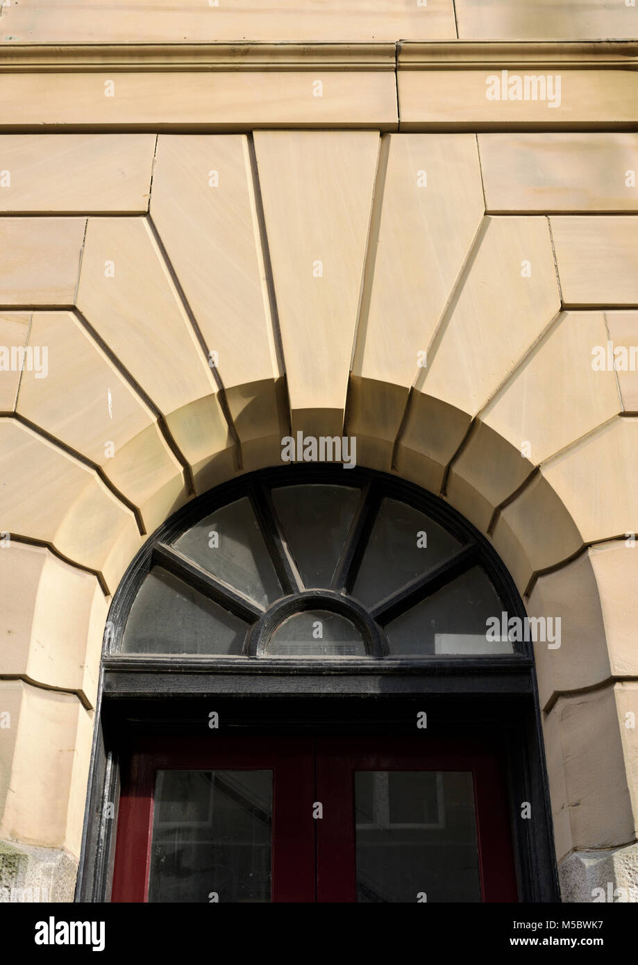 Stone arch door surround, Channelled rustication, ashlar and fanlight ...