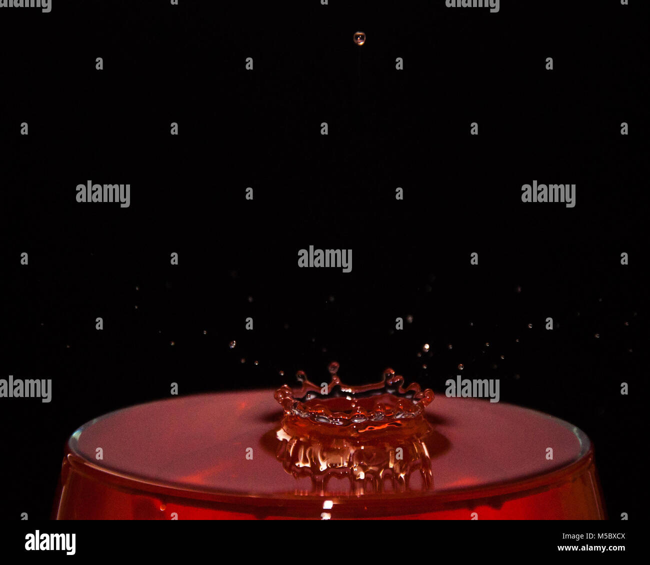 wine red drop splash black background Stock Photo - Alamy