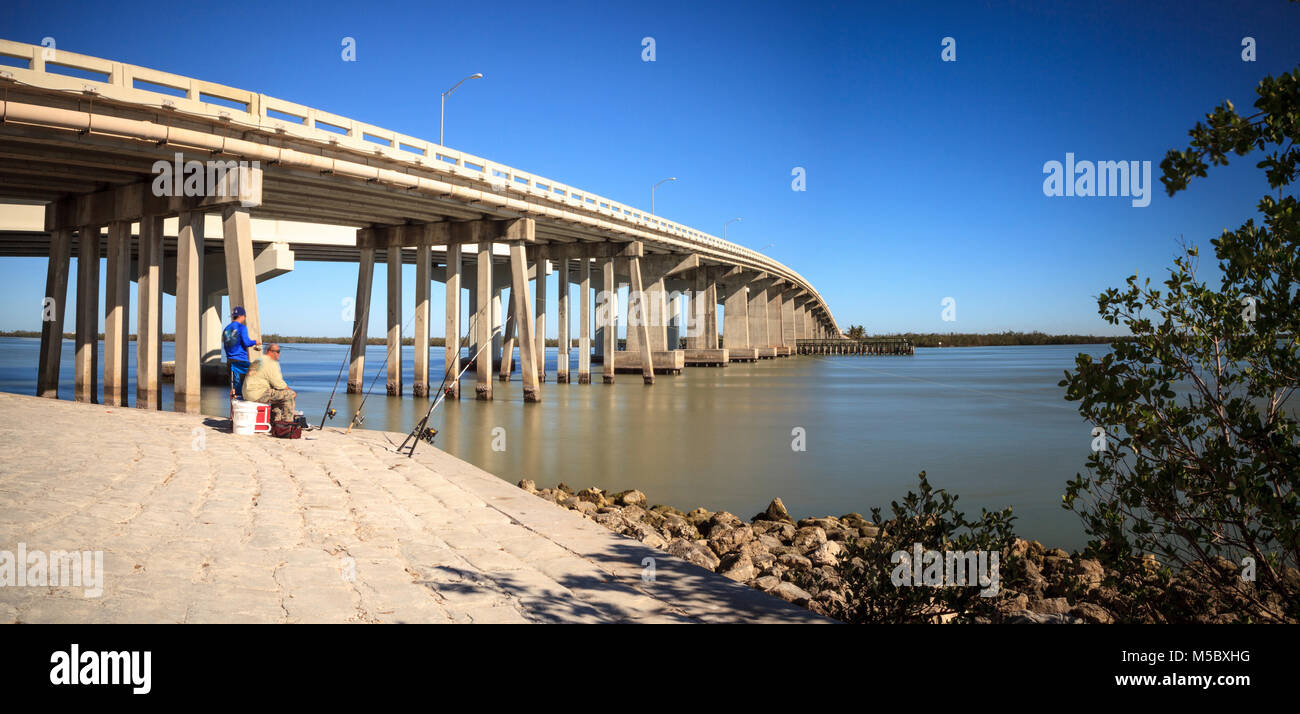 Blue sky over the bridge roadway that journeys onto Marco Island ...