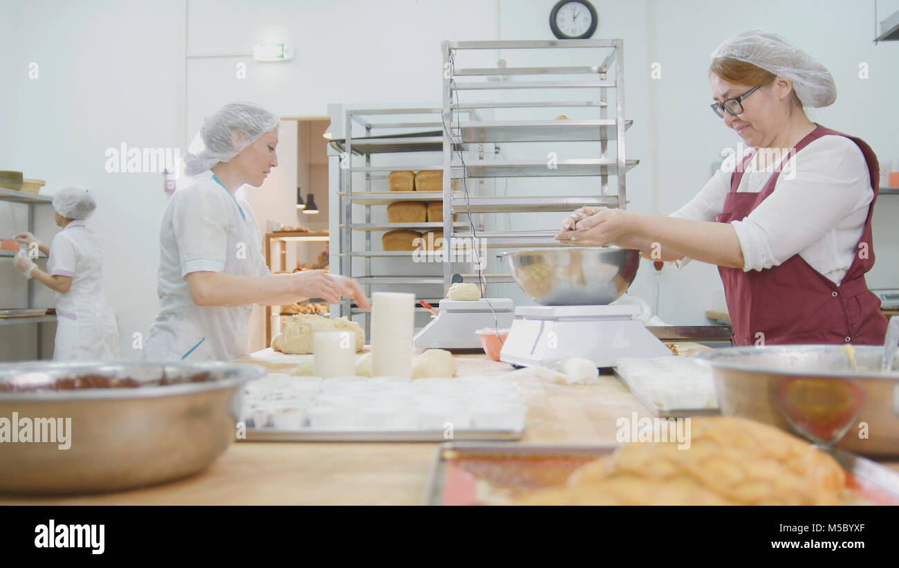 The employees women of the bakery work Stock Photo - Alamy