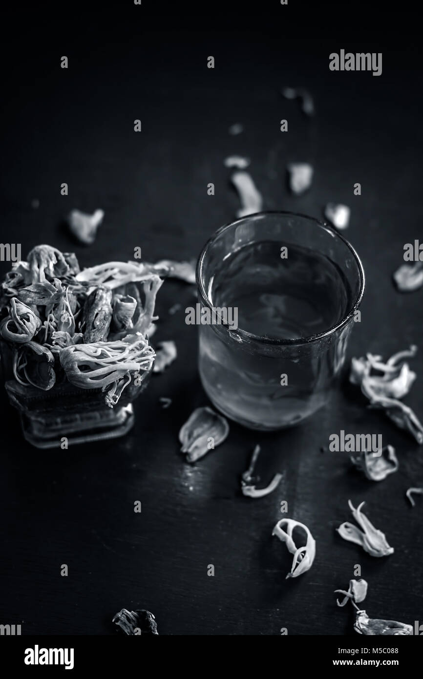 Close up of water of mace,javantri or Myristica fragrans in a glass ...