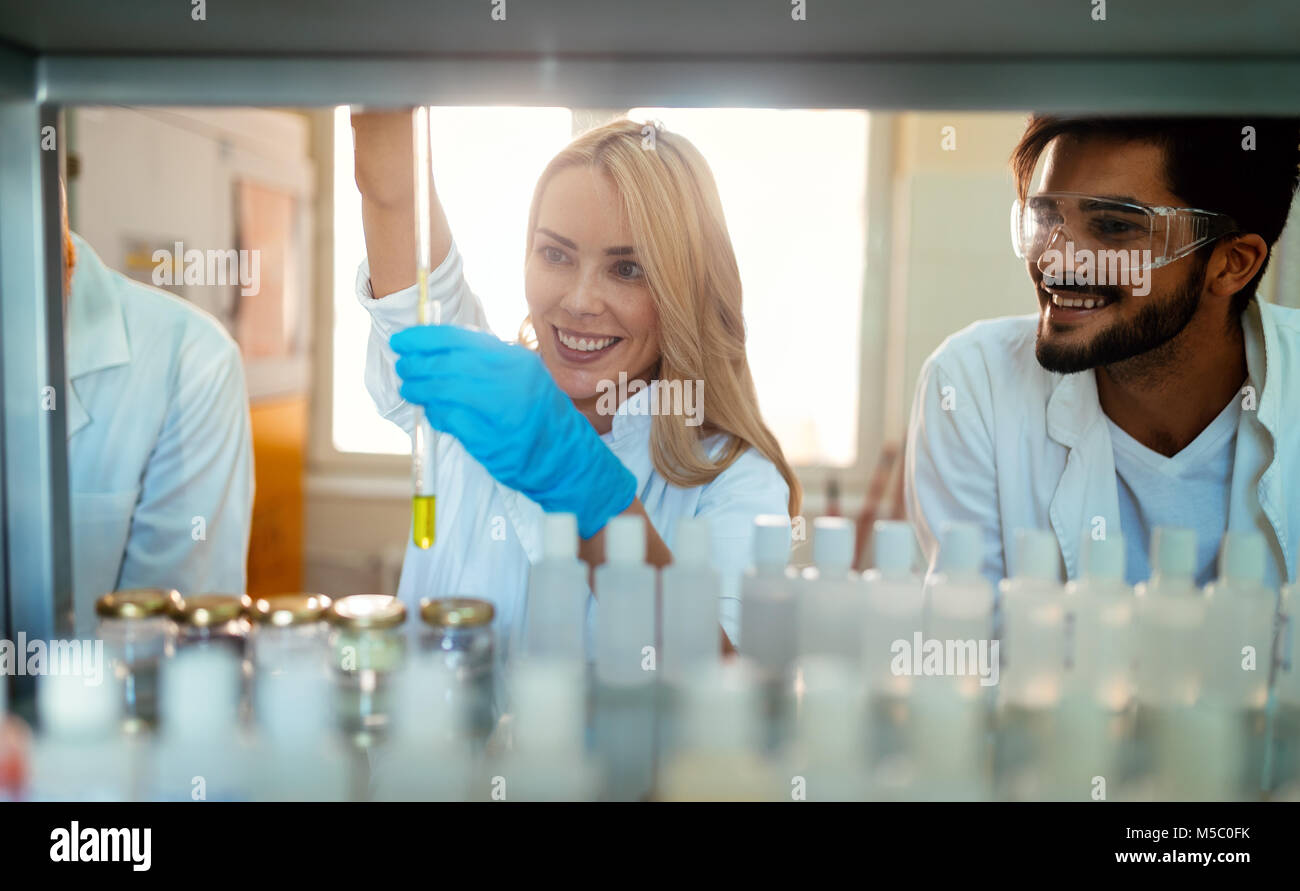 Young students of chemistry working in laboratory Stock Photo - Alamy