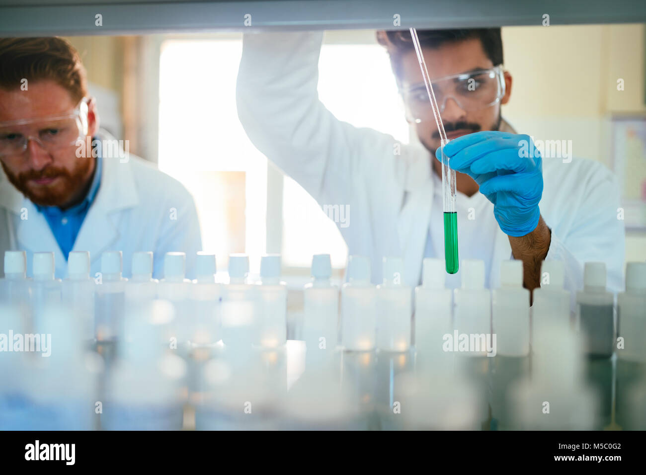 Group of students working at the laboratory Stock Photo - Alamy