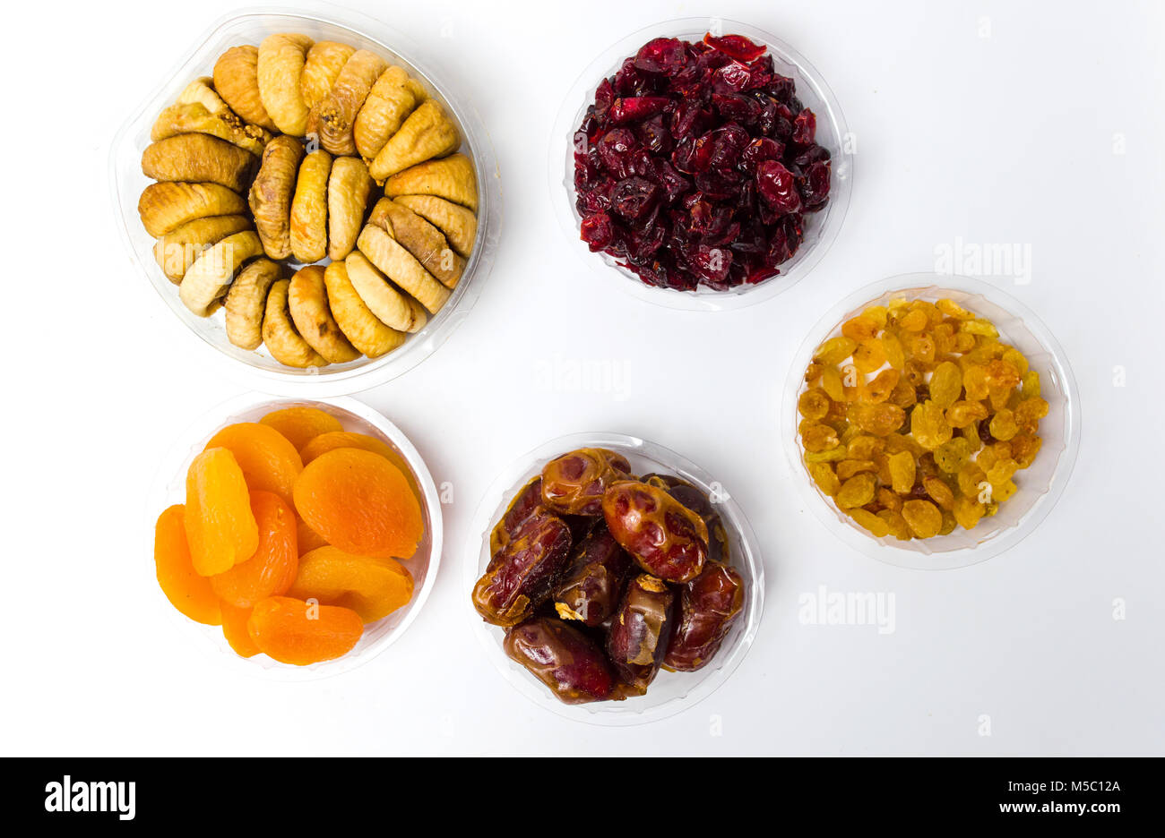Various dried fruits in small bowls top view, healthy snacks Stock ...