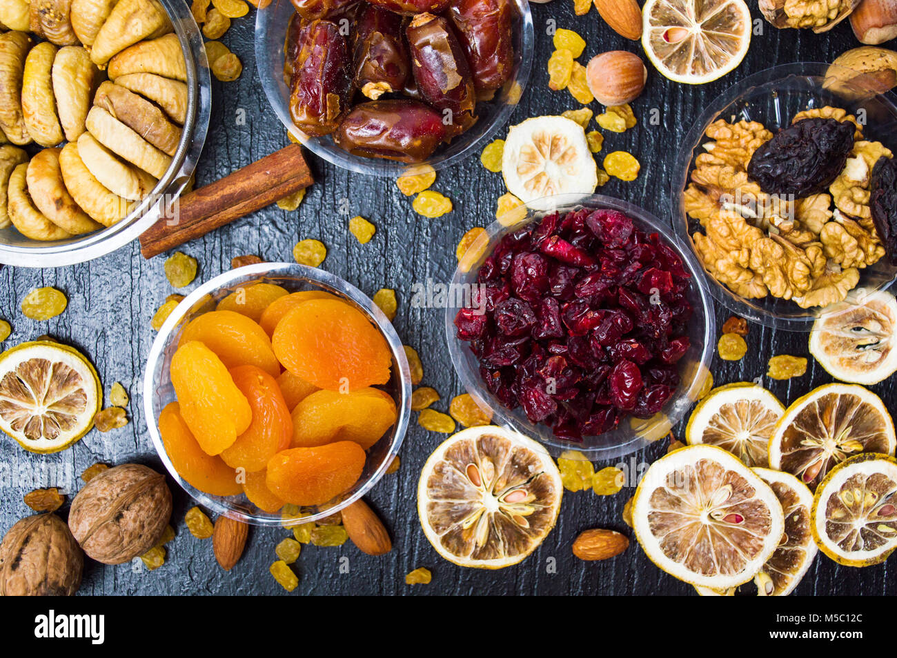 Various dried fruits in small bowls top view, healthy snacks Stock ...
