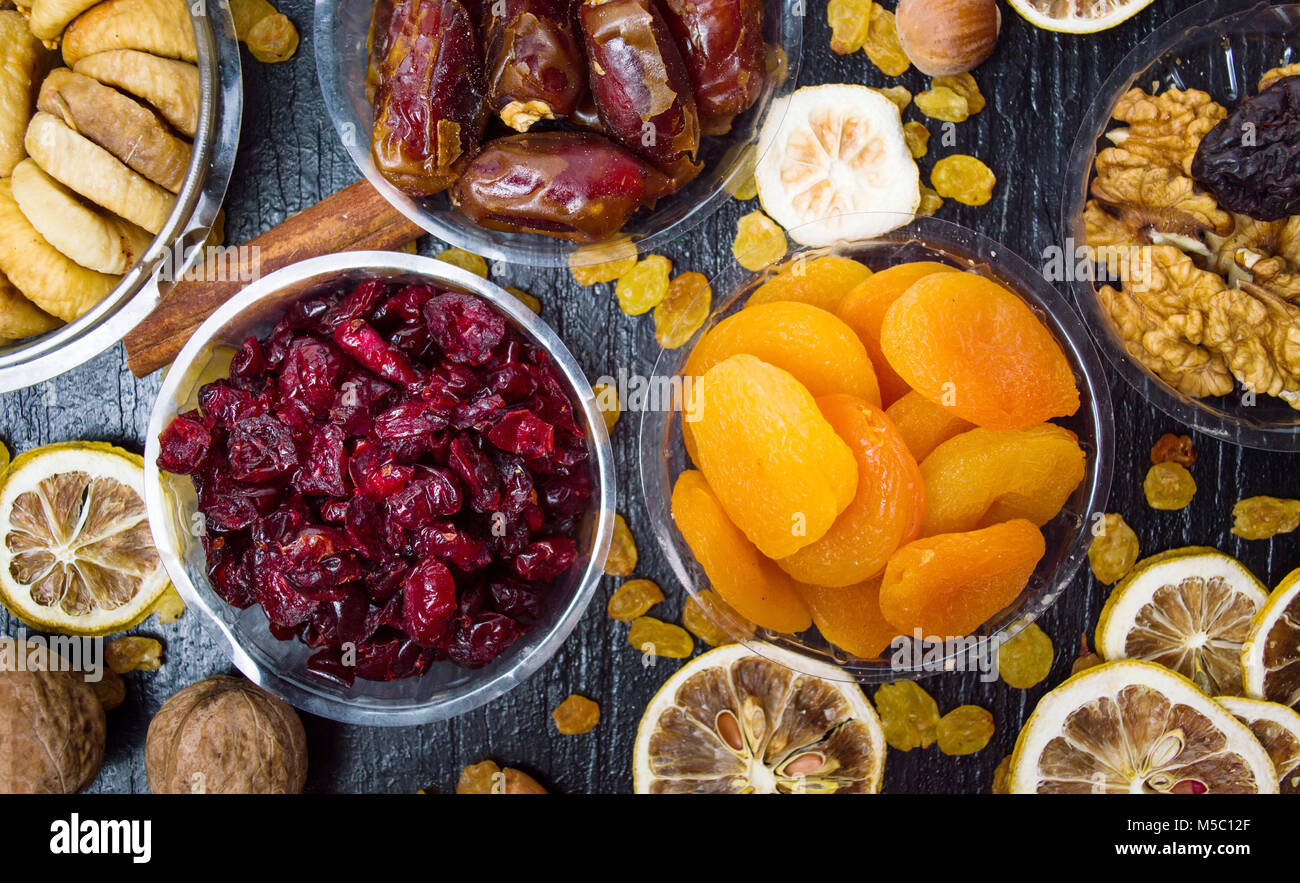 Various dried fruits in small bowls top view, healthy snacks Stock ...