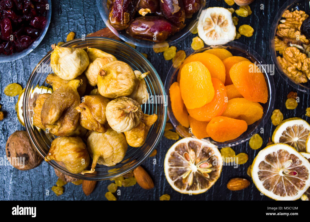 Various dried fruits in small bowls top view Stock Photo - Alamy