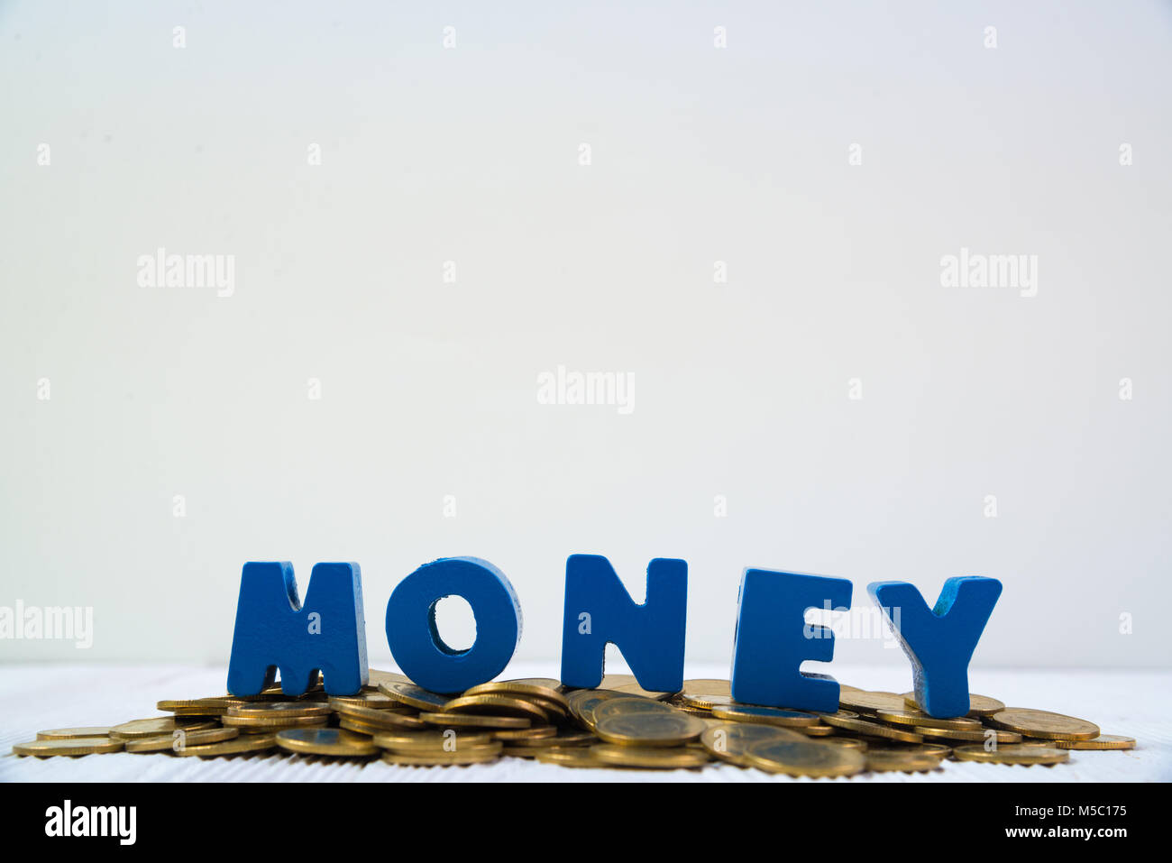 Text MONEY and stack of coin with copy space for add text, motivational ...