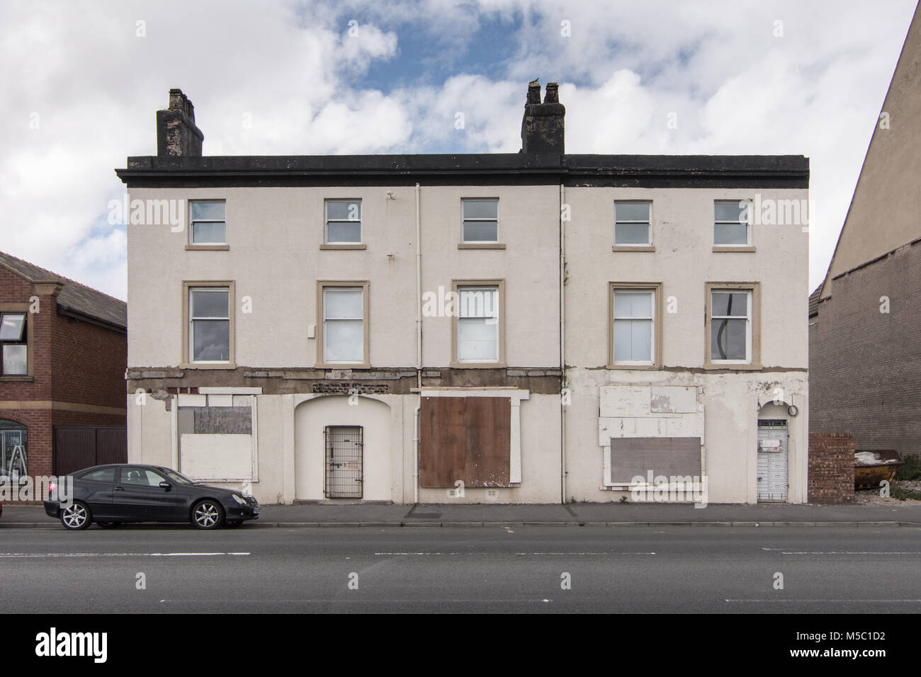 Blackpool, England, UK - August 1, 2015: Houses are boarded up and ...