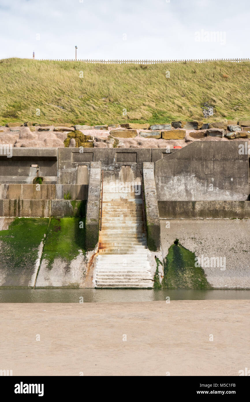A flight of concrete steps leads down the sea wall of Blackpool ...