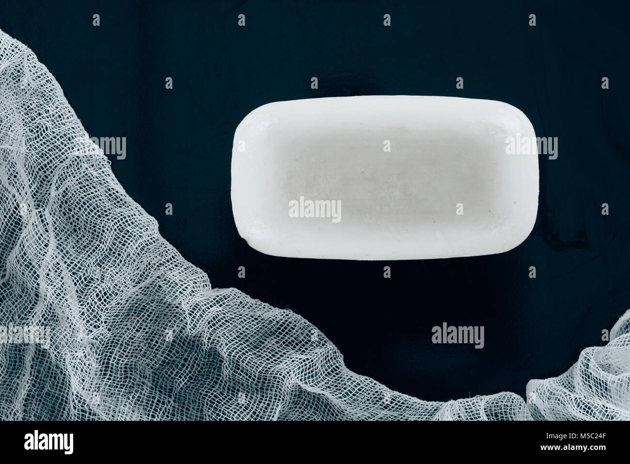 top view of white soap and gauze on black table Stock Photo - Alamy