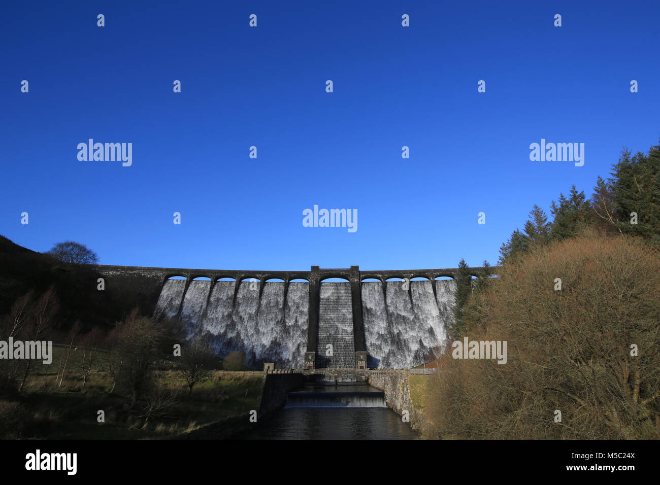 The overflowing Claerwen dam in the Elan valley, Powys, Wales, uk Stock ...