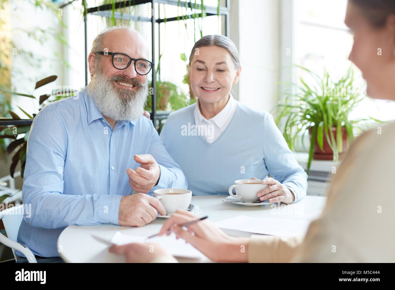 Talk with agent Stock Photo - Alamy