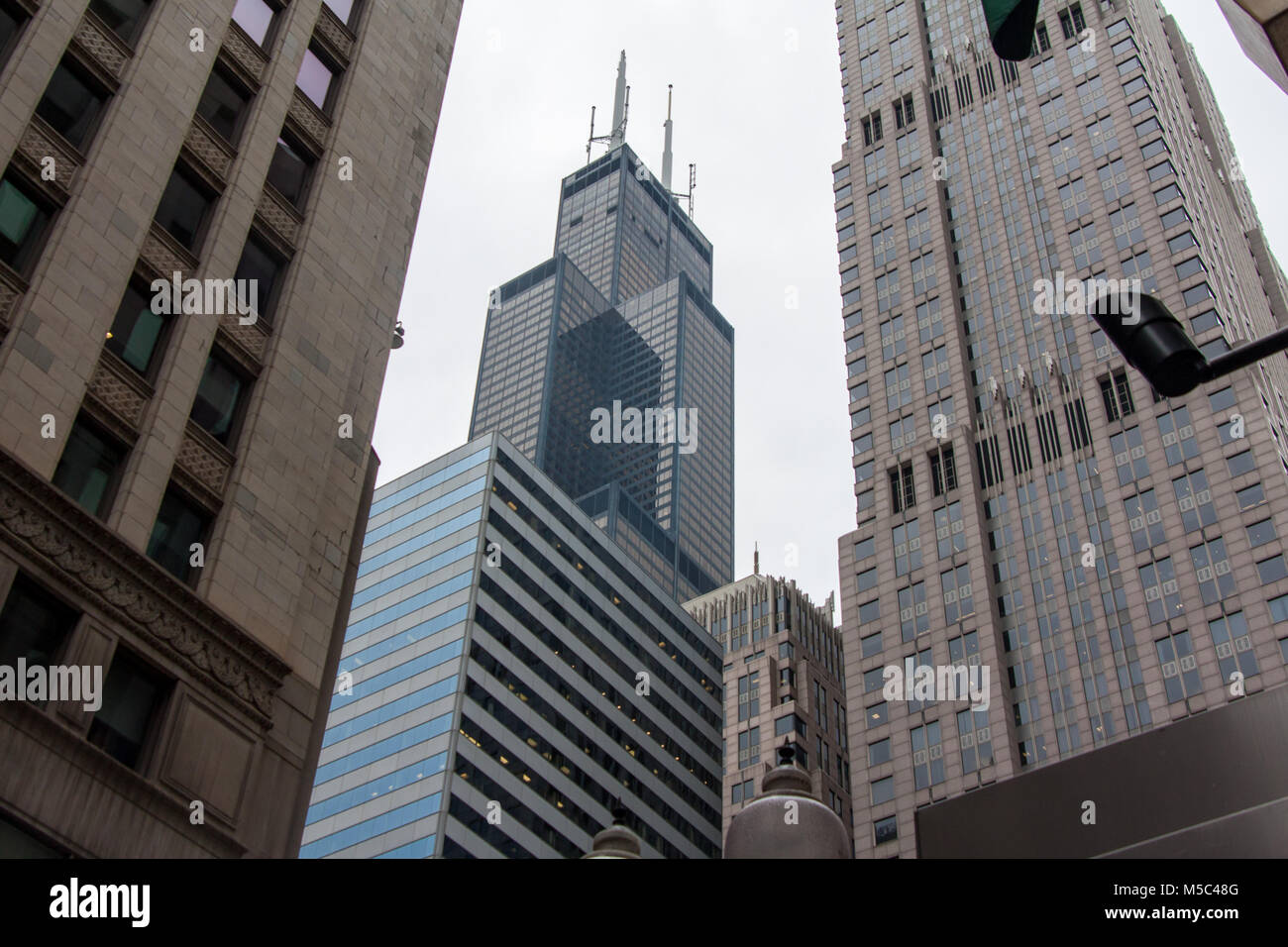 Skyscraper Between Buildings Stock Photo - Alamy