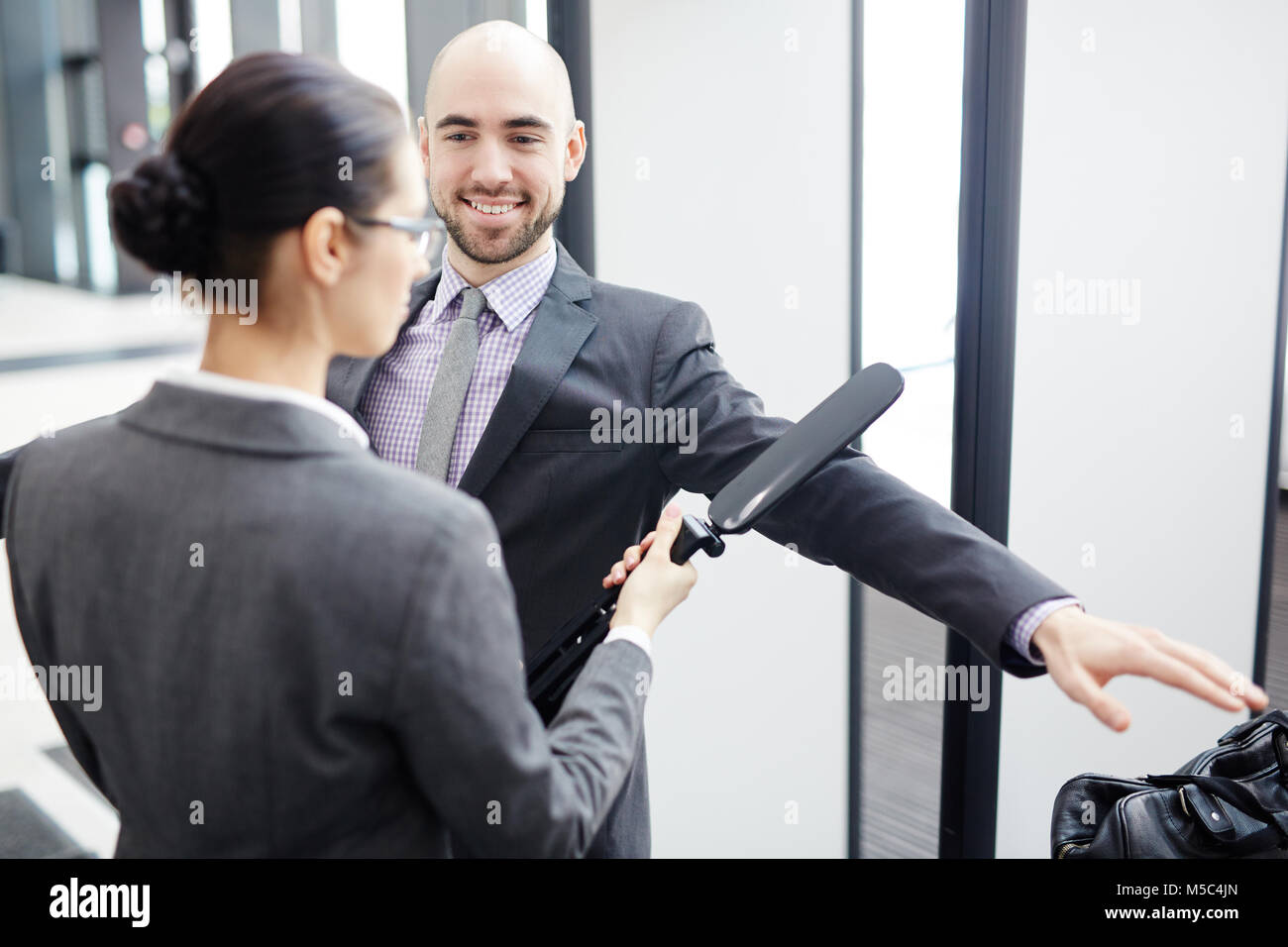 Scanning in security gate Stock Photo - Alamy