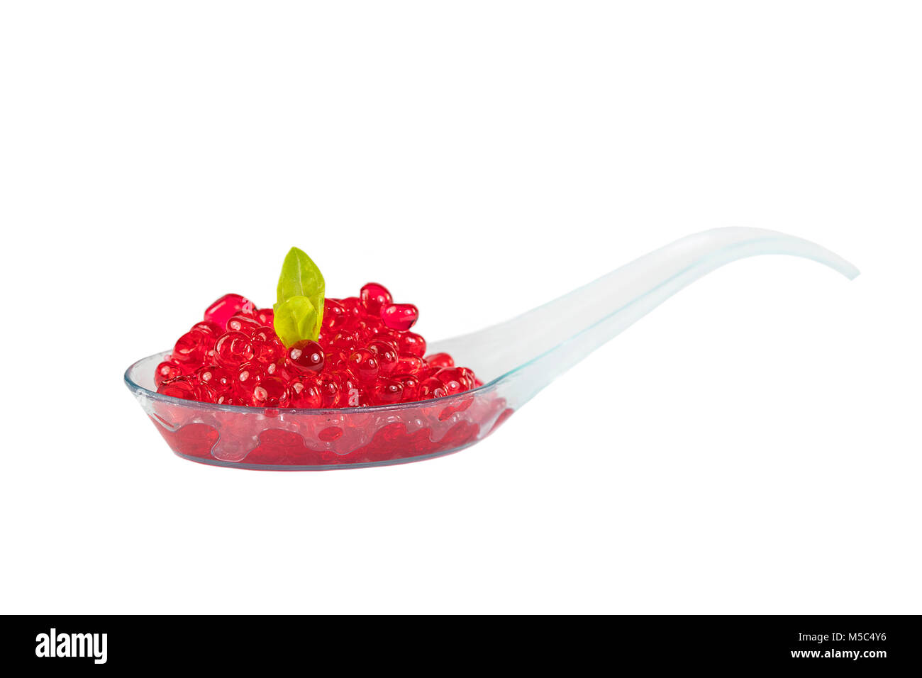 Plastic spoons with fish caviar on a white background Stock Photo - Alamy