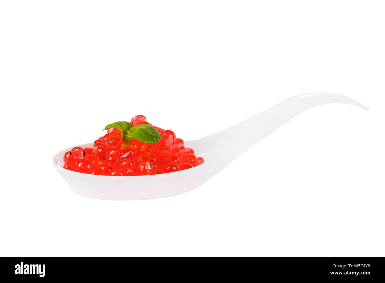 Plastic spoons with fish caviar on a white background Stock Photo - Alamy