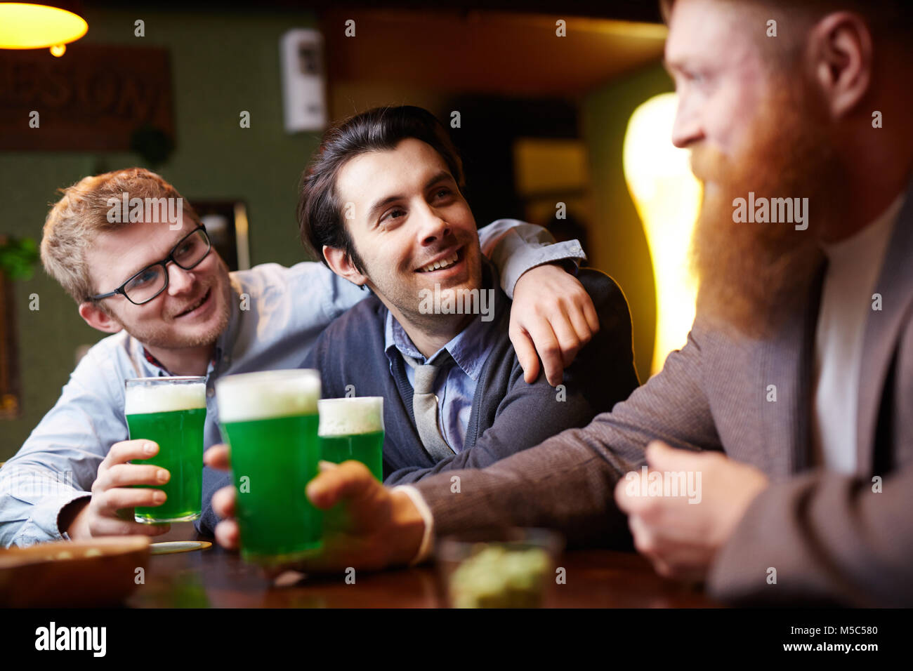 Talking in pub Stock Photo - Alamy