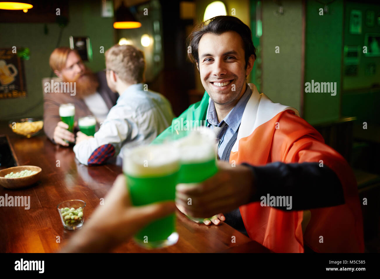 Toasting with friend Stock Photo - Alamy