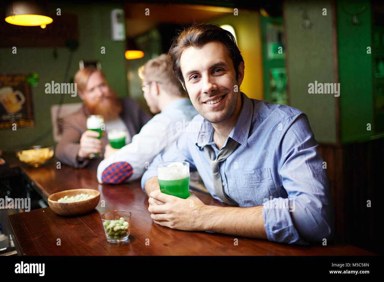 Man by bar counter Stock Photo - Alamy