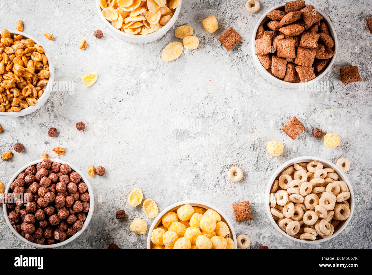Set of various breakfast cereal corn flakes, puffs, pops, grey stone ...