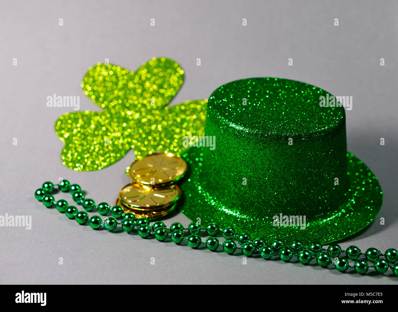 Green Top Hat with gold coins and beads Stock Photo - Alamy