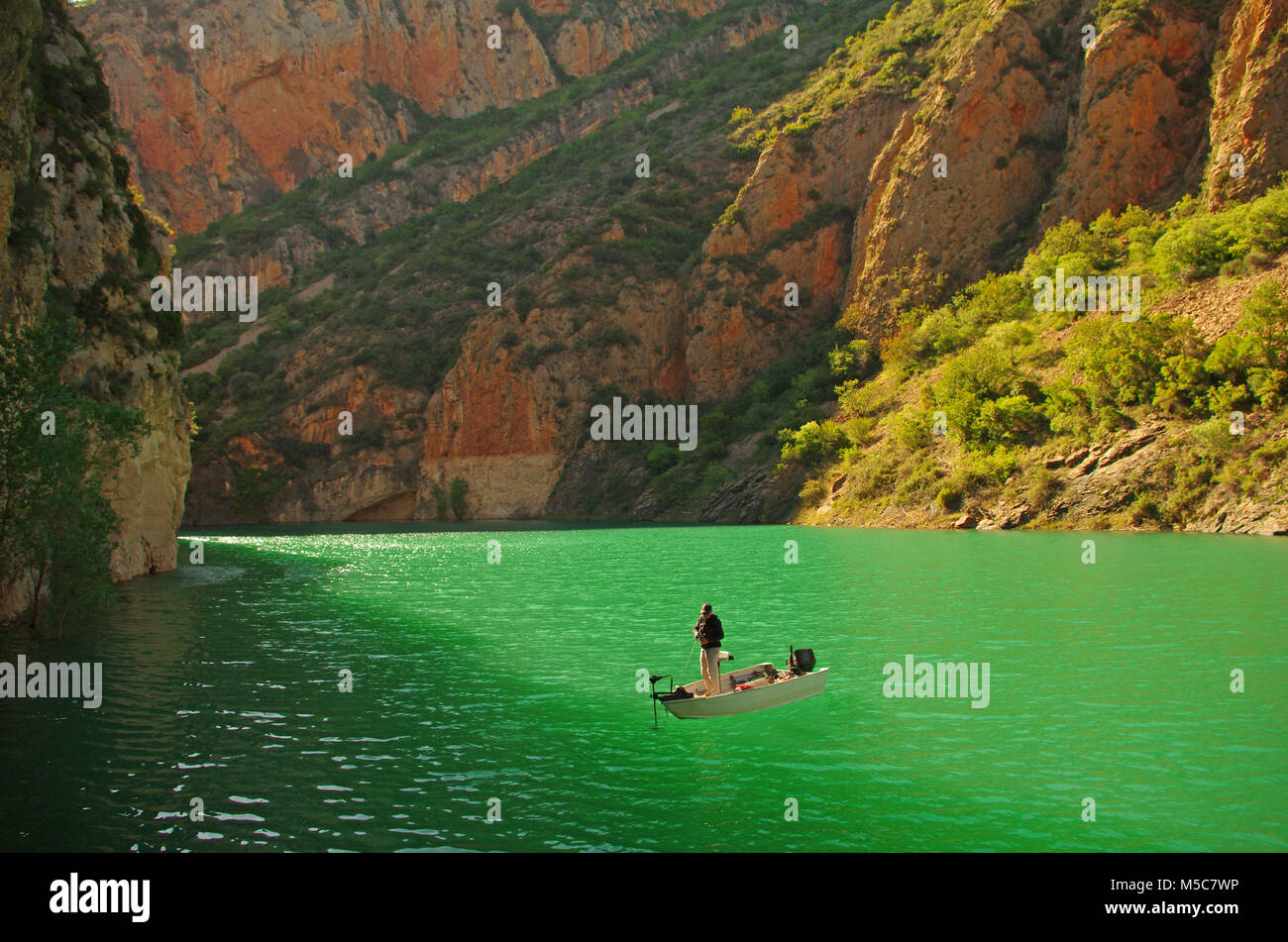 lure fisherman in a boat, alone in the wild. Bass fishing, fishing ...