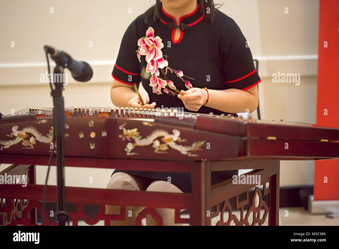 Chinese girl playing instrument hi-res stock photography and images - Alamy