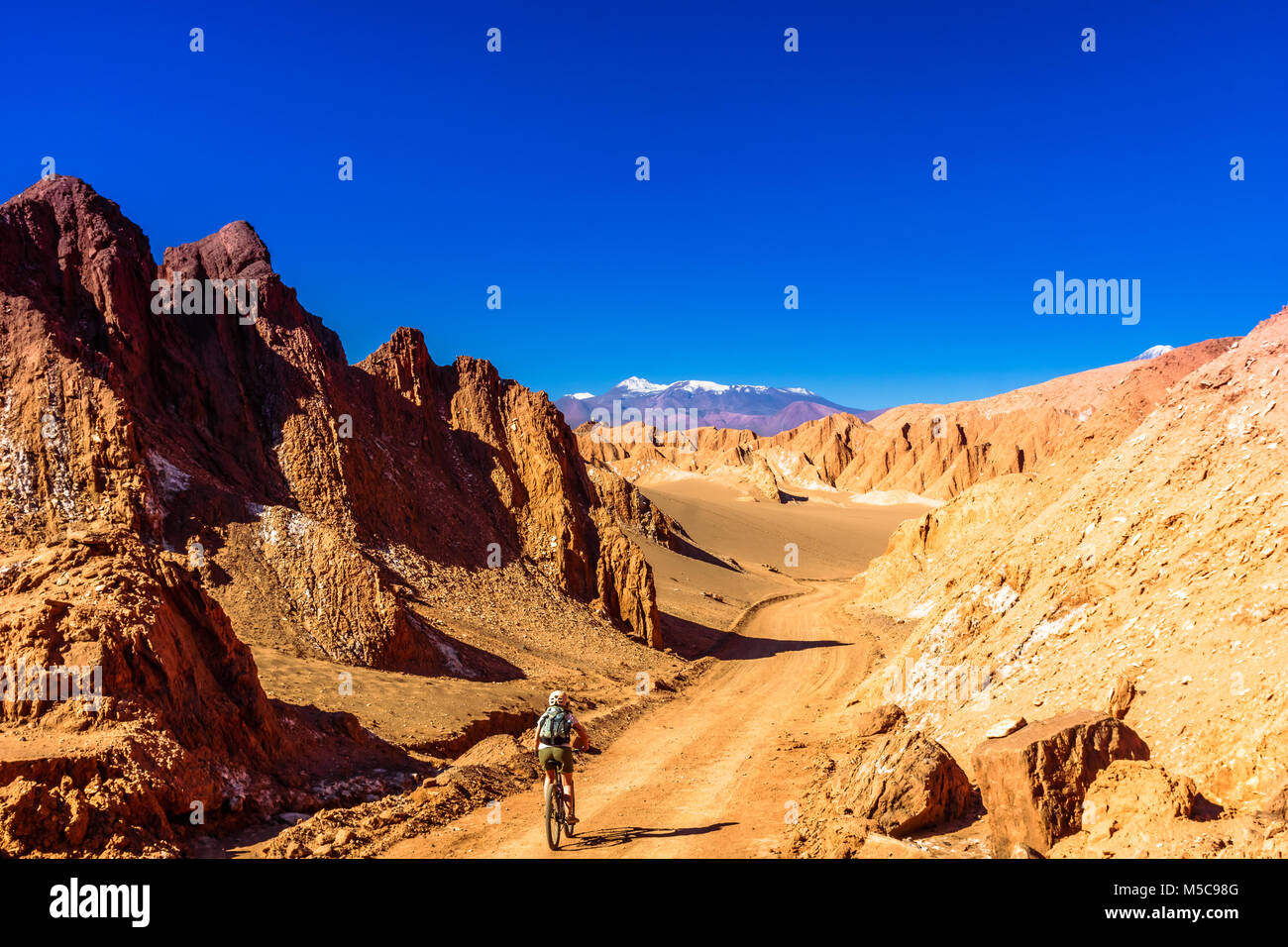View on cyclist in Death Valley by San pedor de Atacama - Chile Stock ...