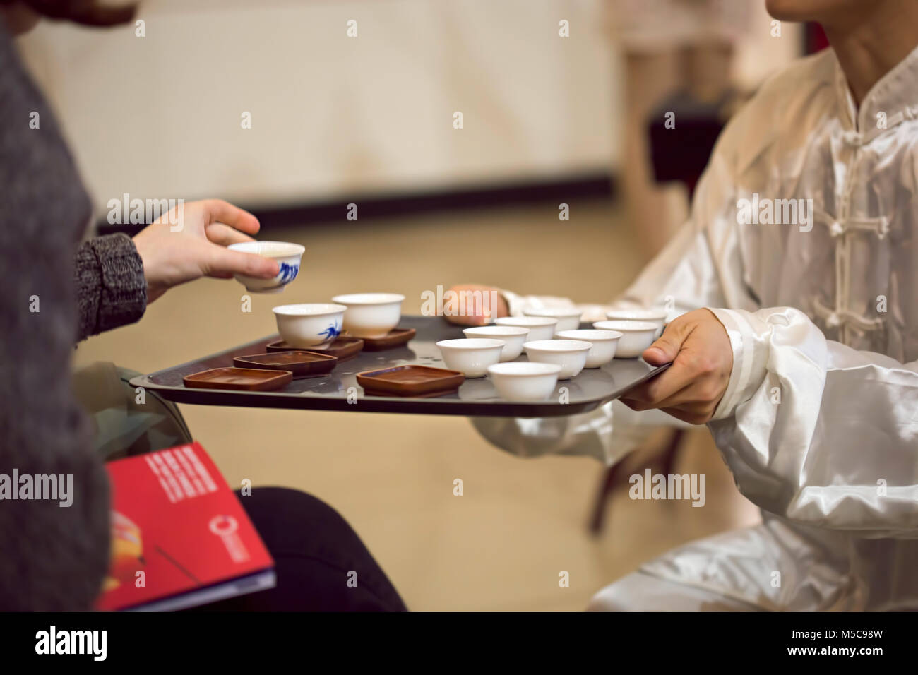 Chinese boy serving traditional Chinese tea Stock Photo - Alamy