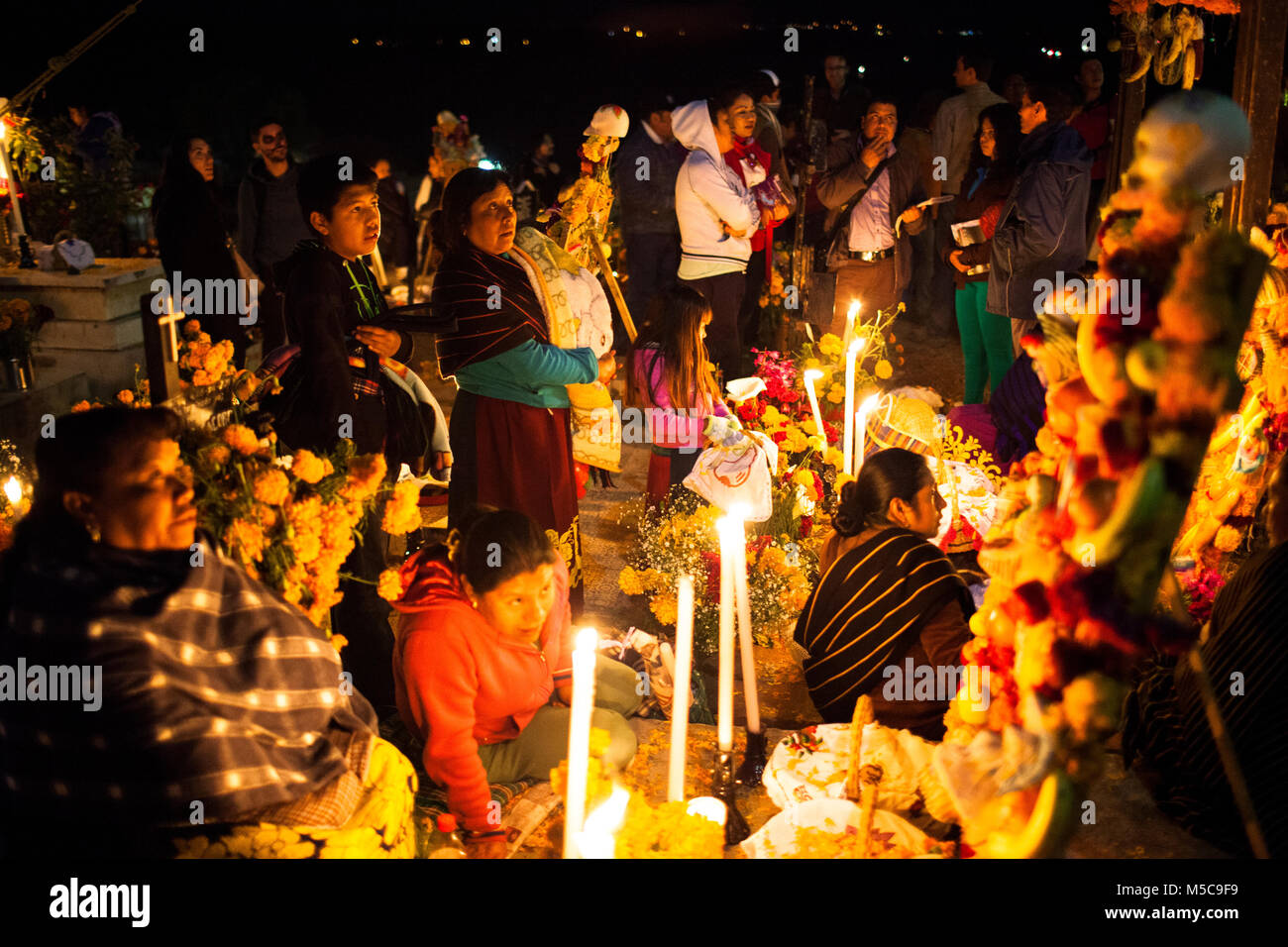 People look at decorated graves on Janitzio Island during Dia de los ...