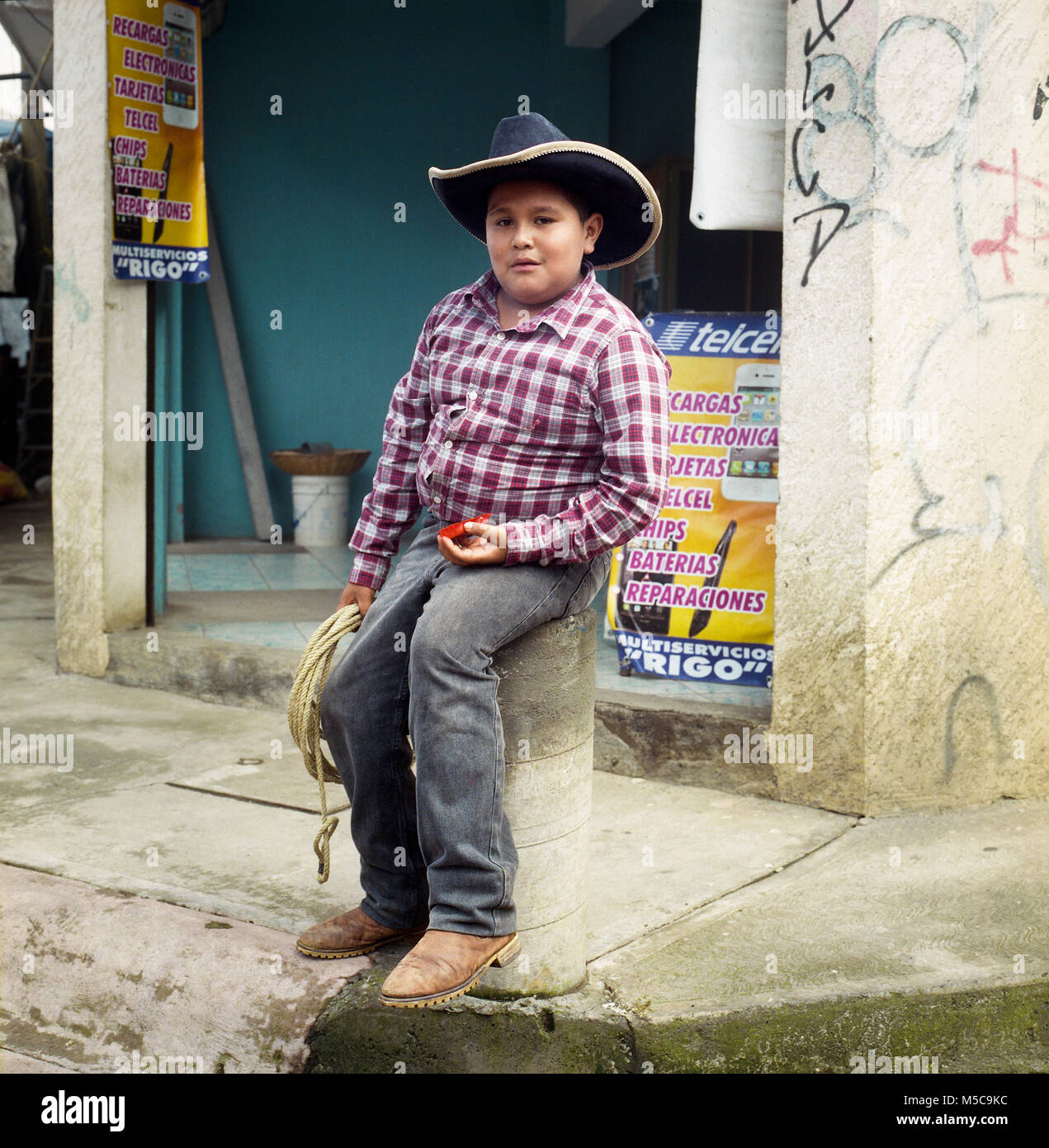 A boy poses for a photo during the annual fall fiesta in Cheran ...