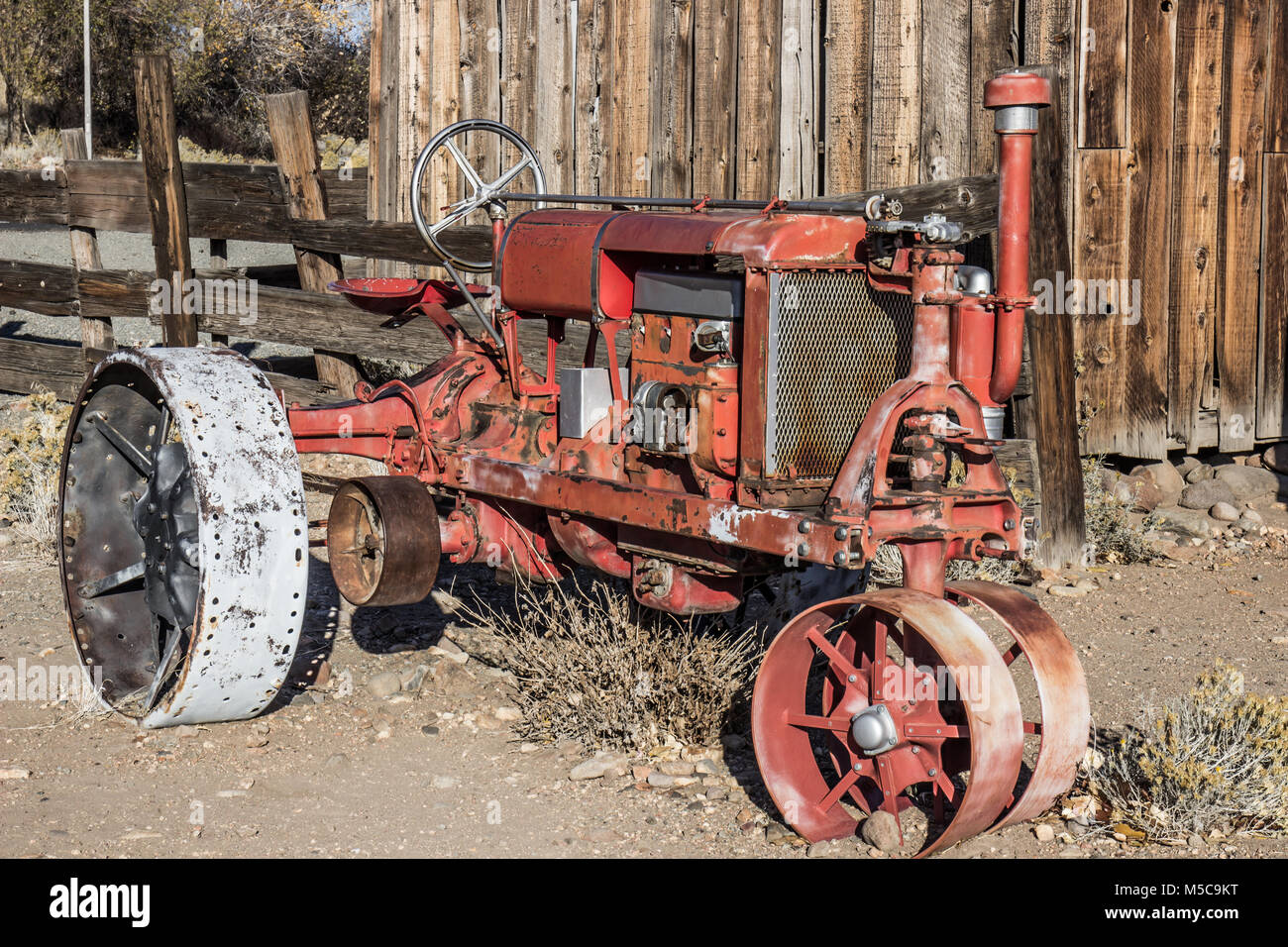 Vintage Orange Tractor With Unique Wheels Stock Photo - Alamy