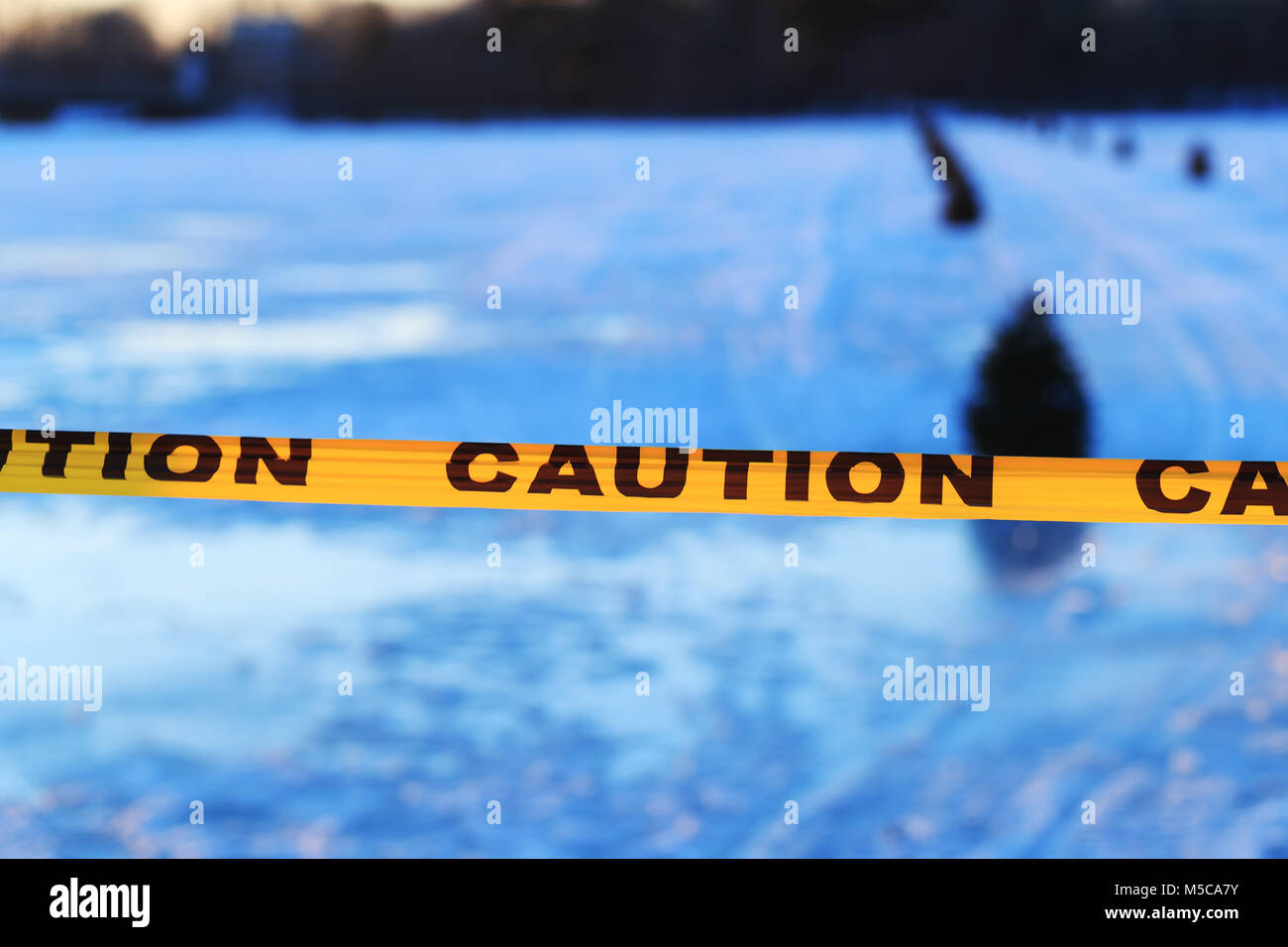 Caution or warning sign of drowning, frozen lake formed by a dam in the ...