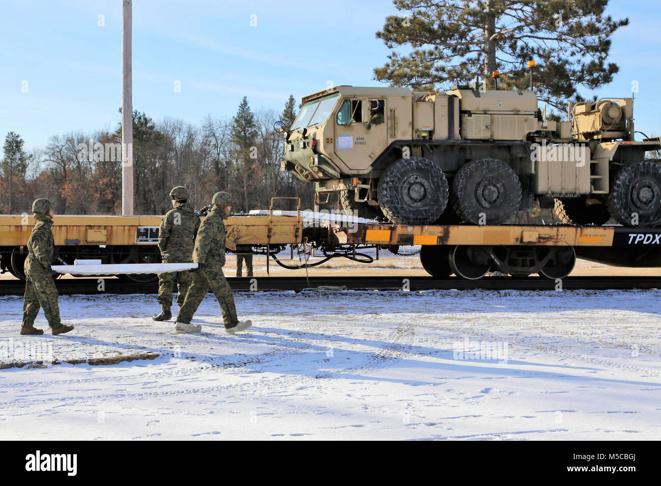Marines with Marine Wing Support Squadron (MWSS) 271 load equipment on ...