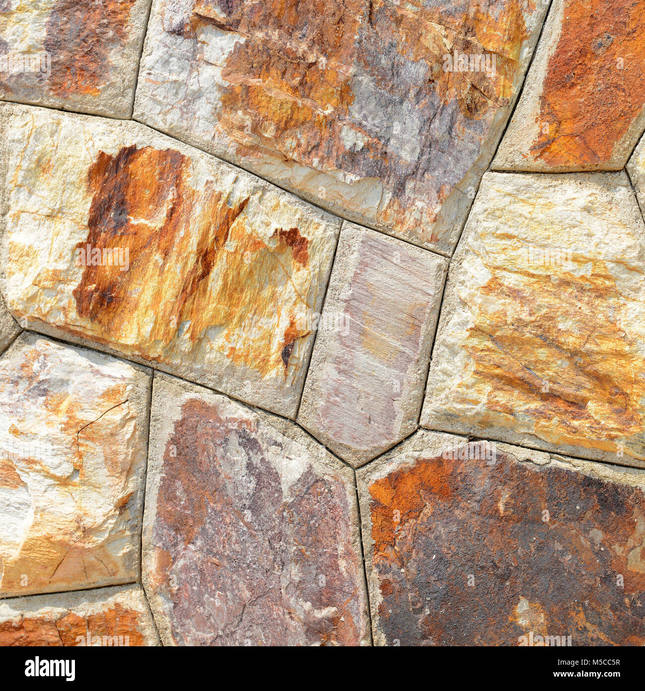 Brown stone wall texture and background Stock Photo - Alamy