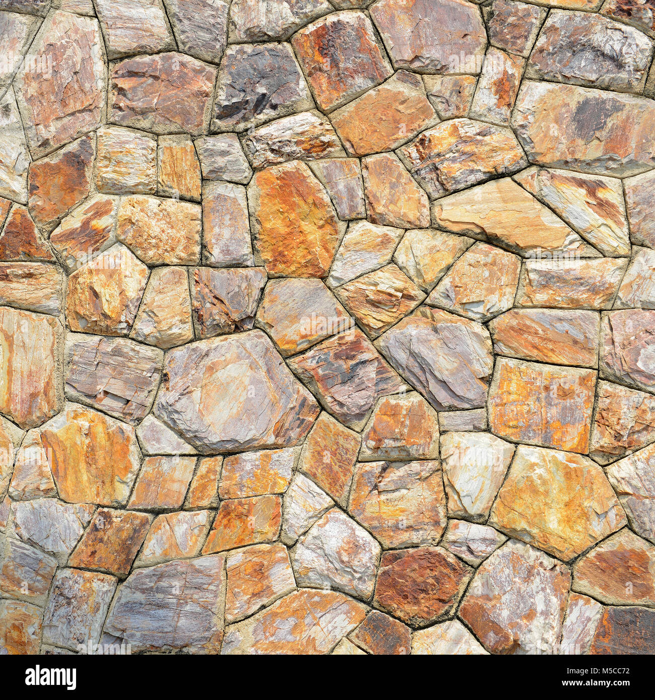 Brown stone wall texture and background Stock Photo - Alamy