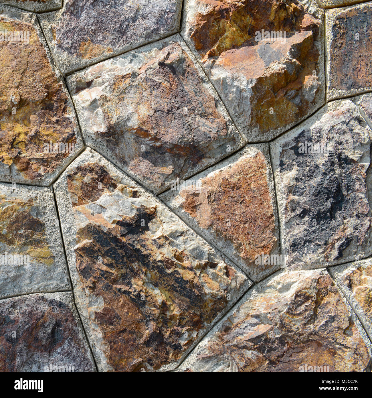 Brown stone wall texture and background Stock Photo - Alamy
