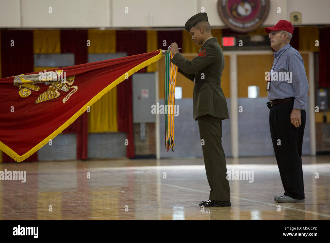 A U.S. Marine with 2nd Marine Division (2d MARDIV), left, and a 2d ...
