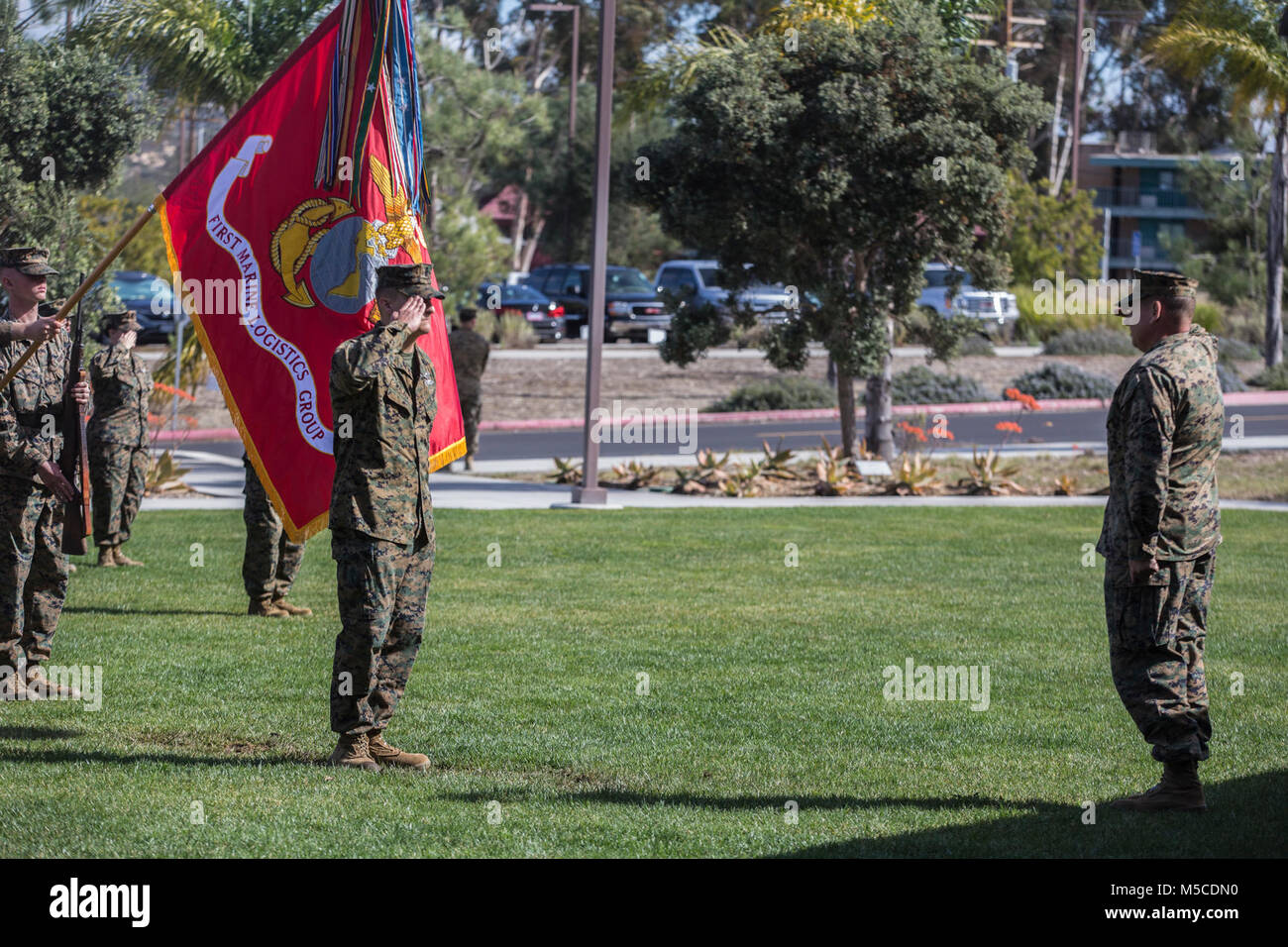 U.S. Marines and Sailors with 1st Marine Logistics Group salute Brig ...